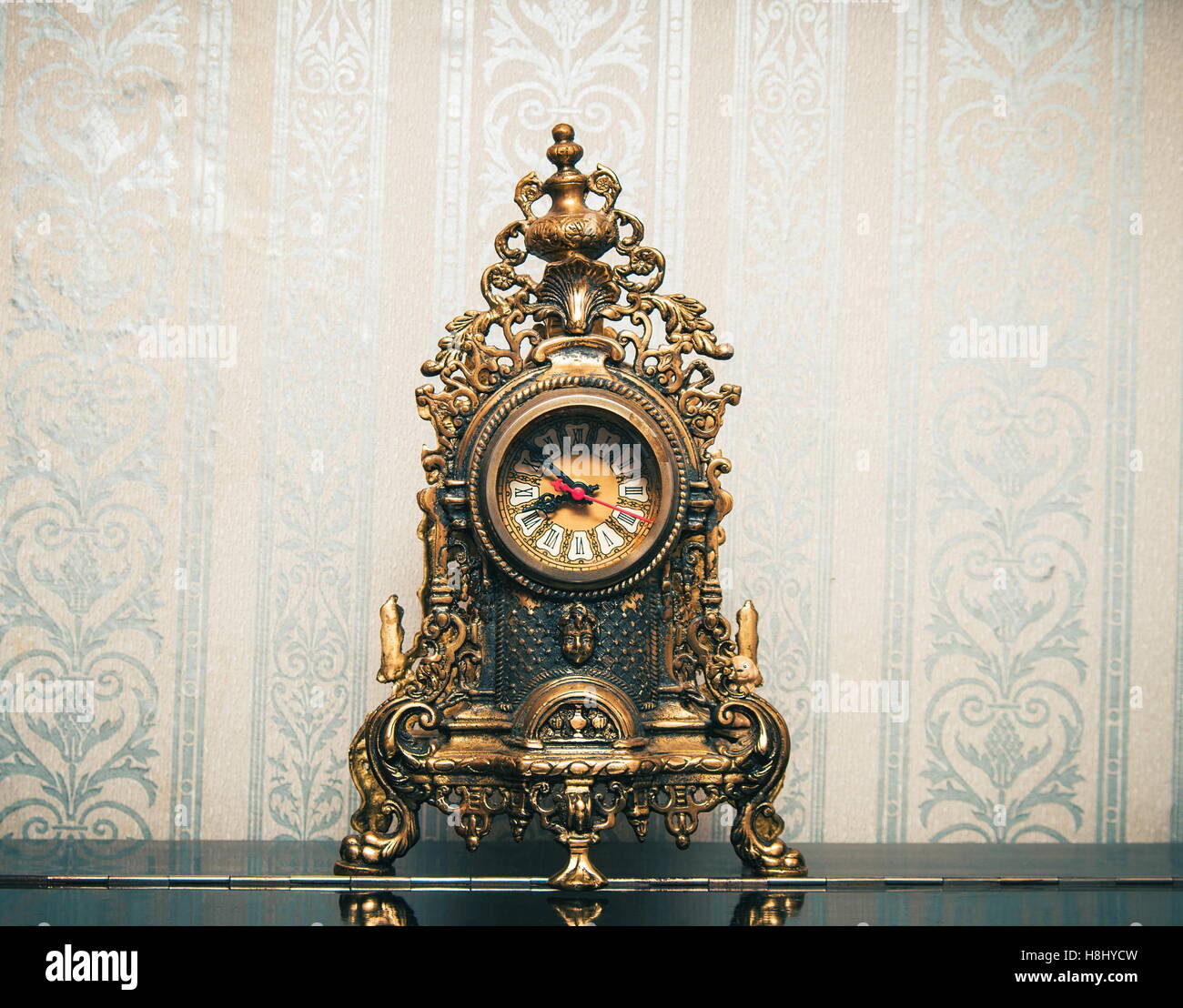 old vintage clock on table Stock Photo - Alamy