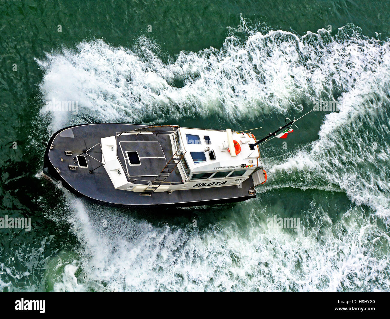 Venice cruise ship pilot boat riding the waves Stock Photo - Alamy