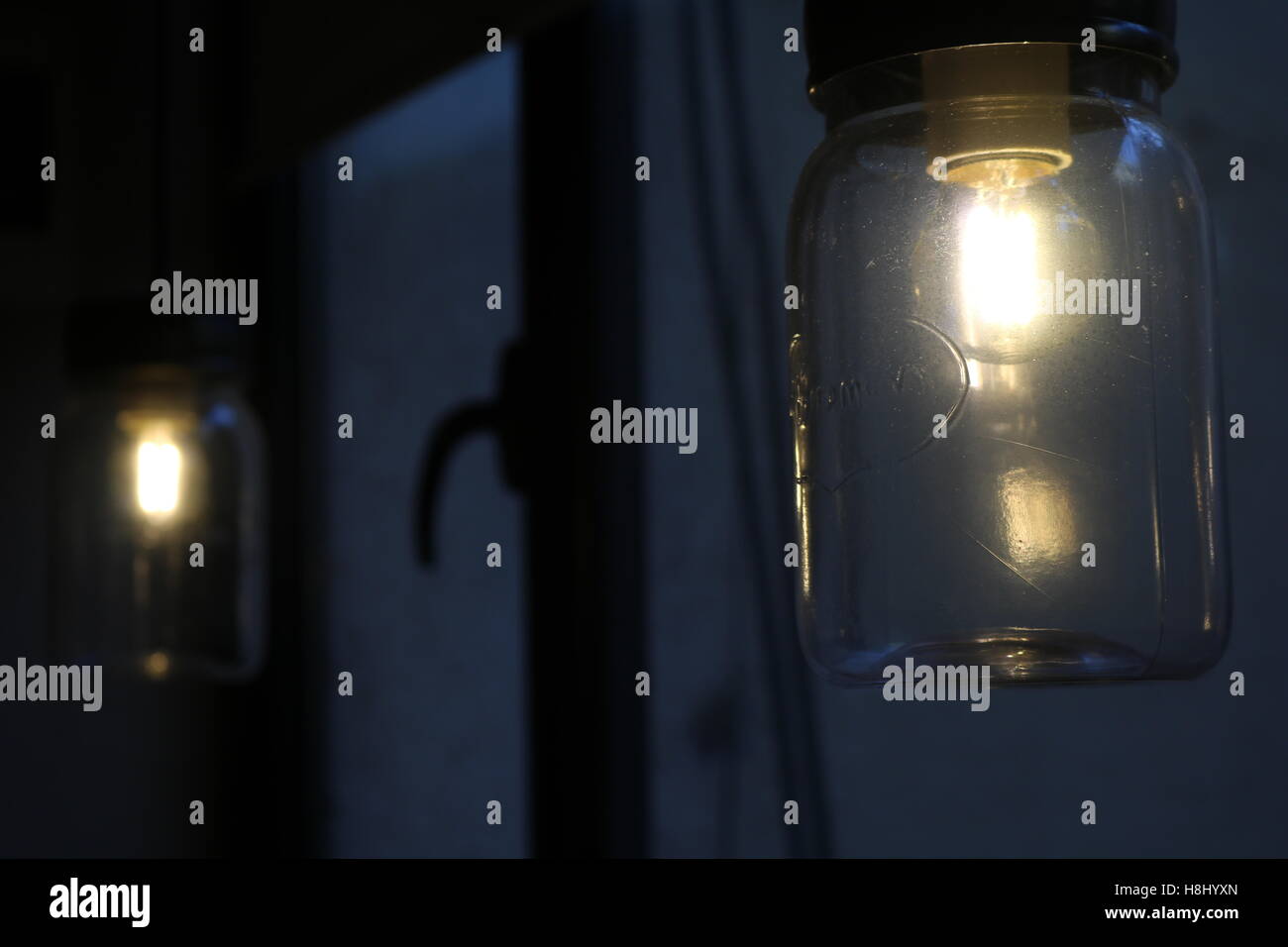 Lights glowing in an evening window Stock Photo - Alamy