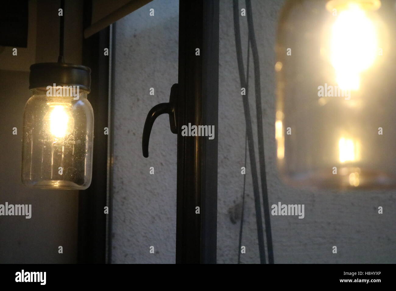 Lights glowing in an evening window Stock Photo - Alamy