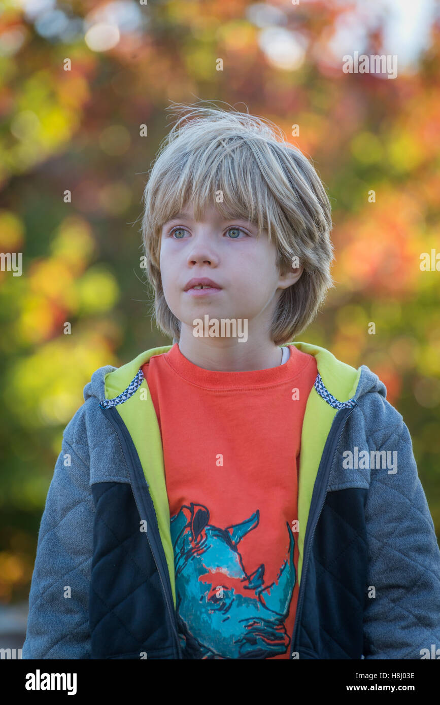 Portrait of a young boy with blurred background Stock Photo - Alamy