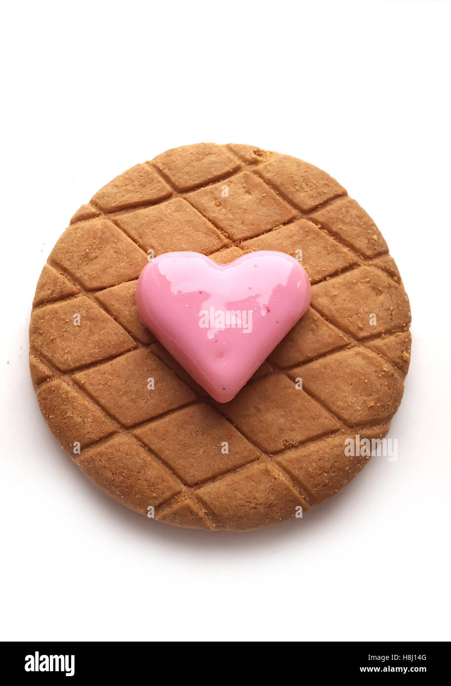 Sweet red marzipan heart and Crunchy fresh biscuits on a white ...