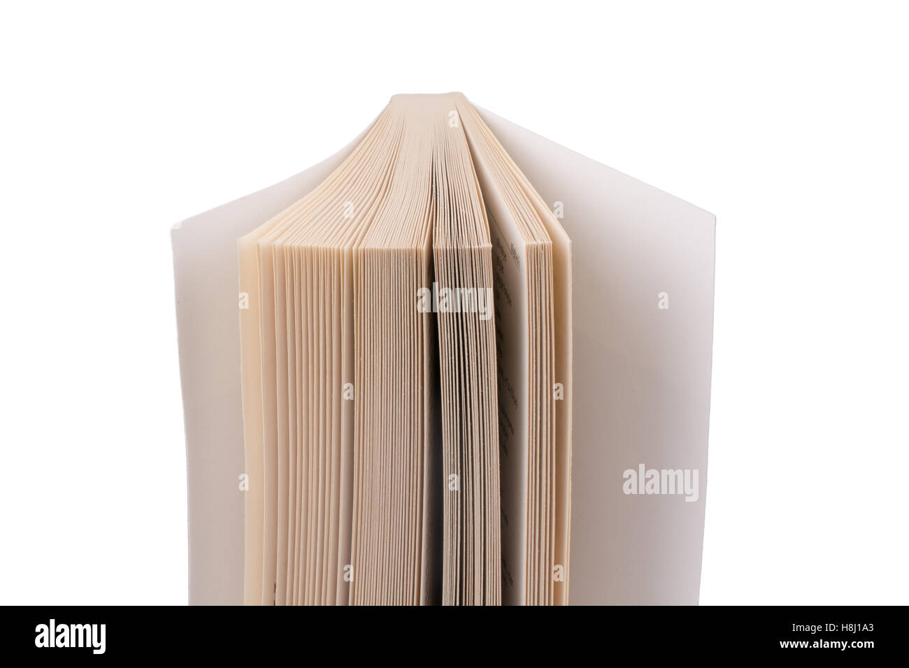 Book pages partly in view on white background Stock Photo - Alamy