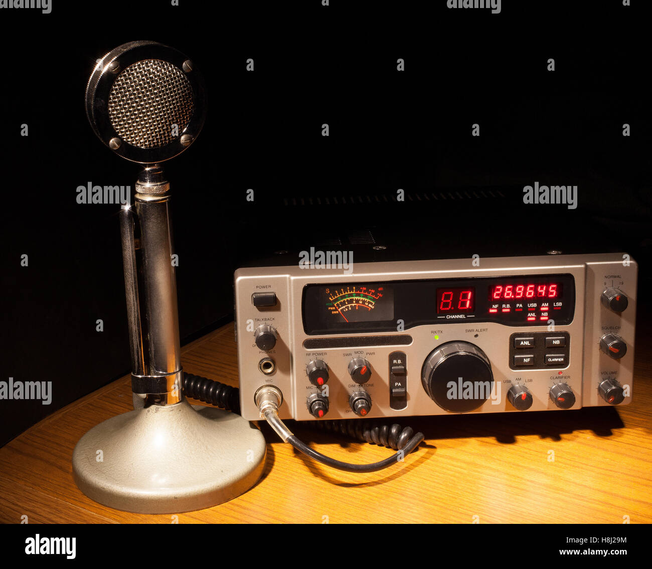 Two way radio and microphone that are on a dark desk Stock Photo - Alamy