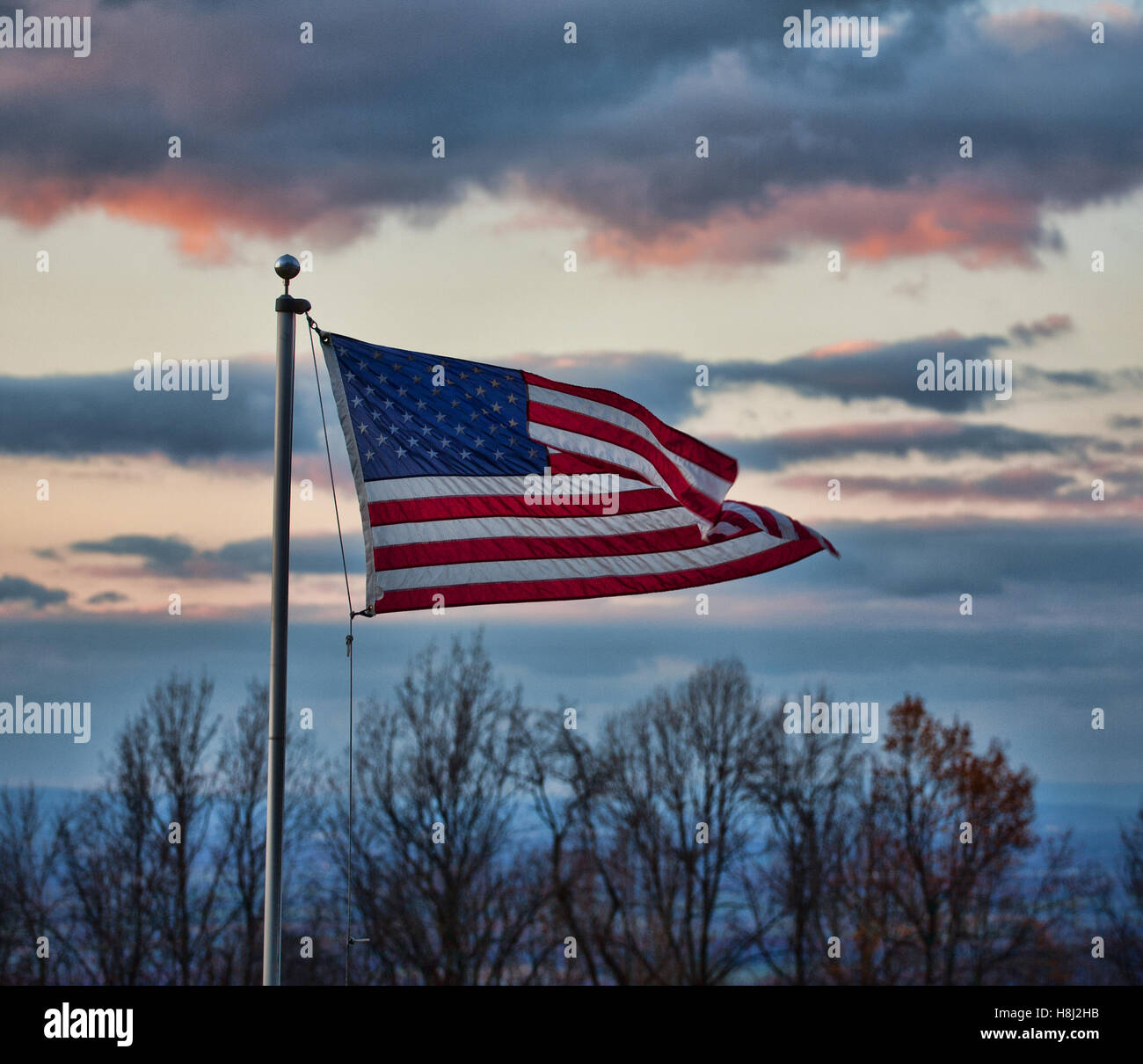 American flag flying at dusk over the Blue Ridge in Virginia Stock ...