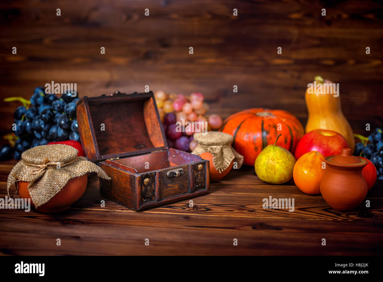 Thanksgiving holiday background with opened chest treasure, apple, pear ...