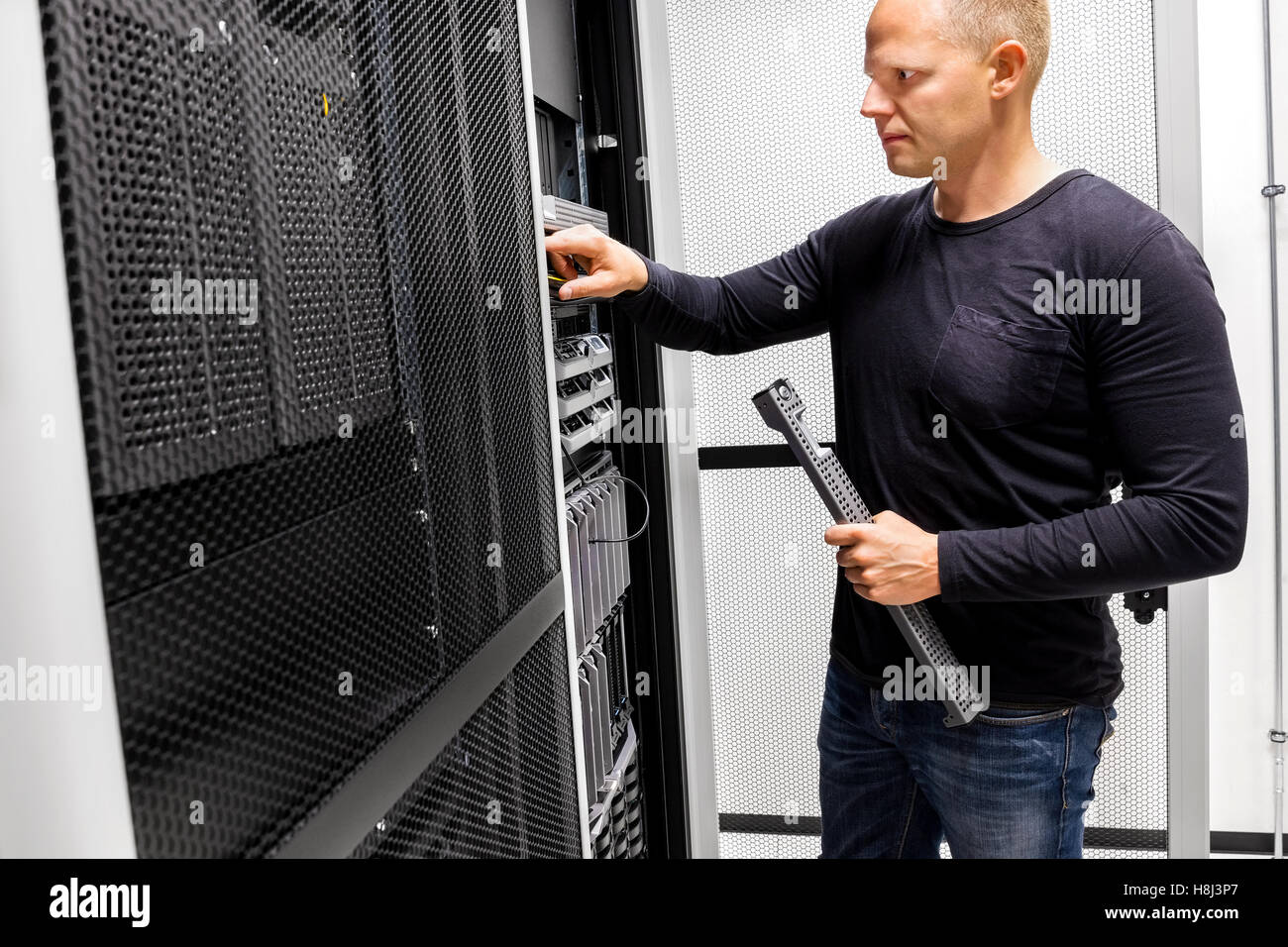 Male Engineer Working On Server At Data Center Stock Photo - Alamy