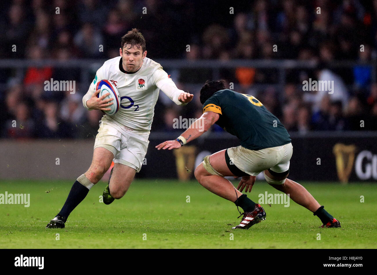England's Elliot Daly (left) and South Africa's Warren Whiteley during ...