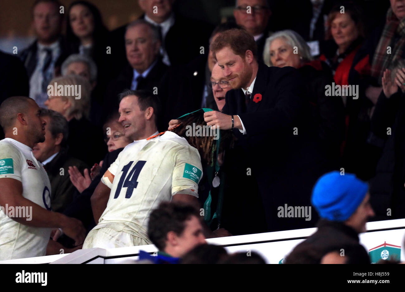 Prince Harry hands over a medal to England's Marland Yarde after the ...