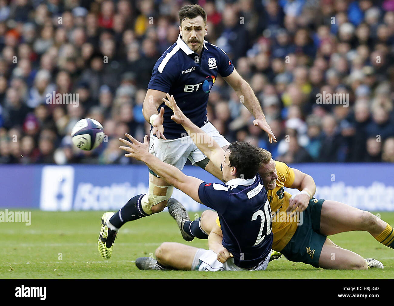 Scotland's Alex Dunbar (left) looks on as team-mate John Hardie reaches ...