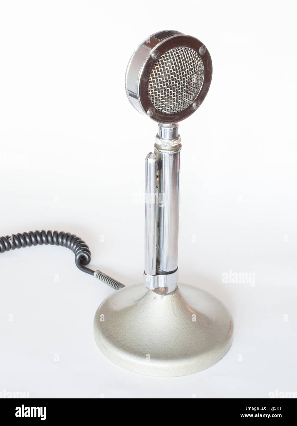 Old style microphone and cord on a white background Stock Photo - Alamy