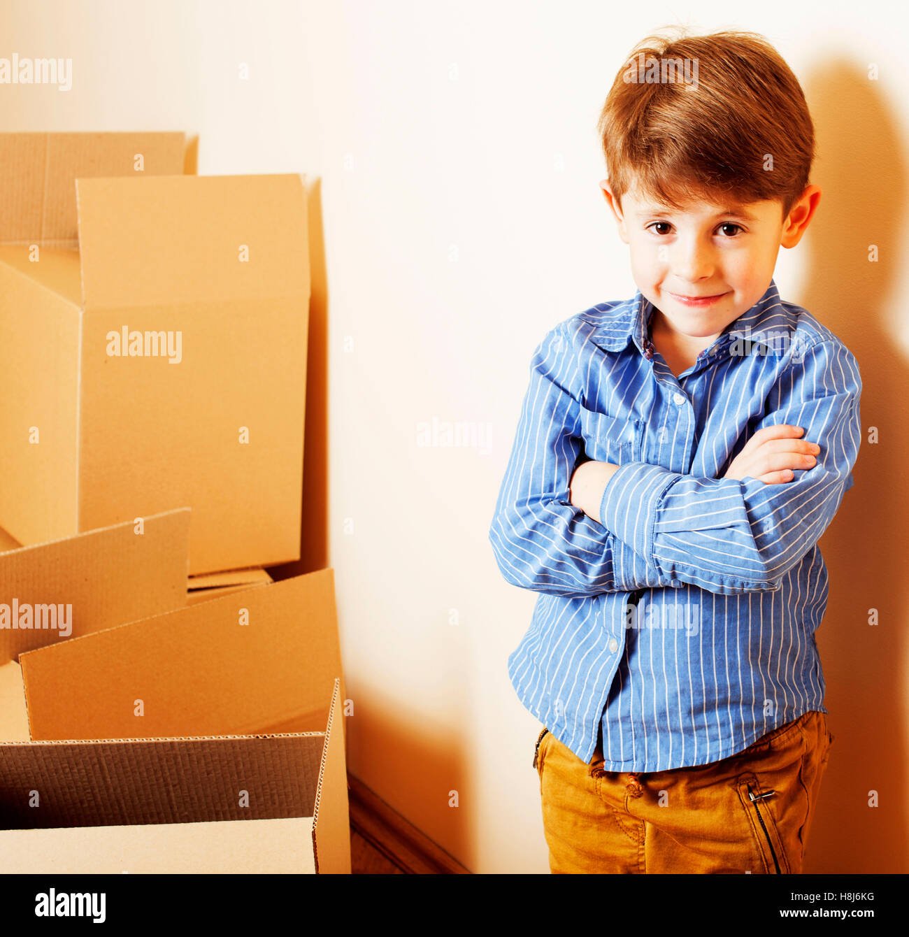little cute boy in empty room, remoove to new house. home alone Stock ...