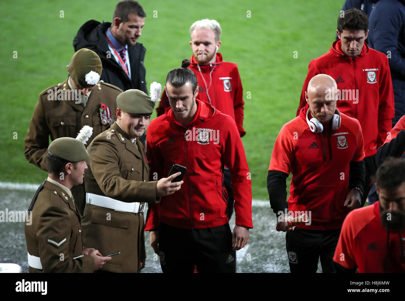 Wales' Gareth Bale poses for photographs with military prior to the ...