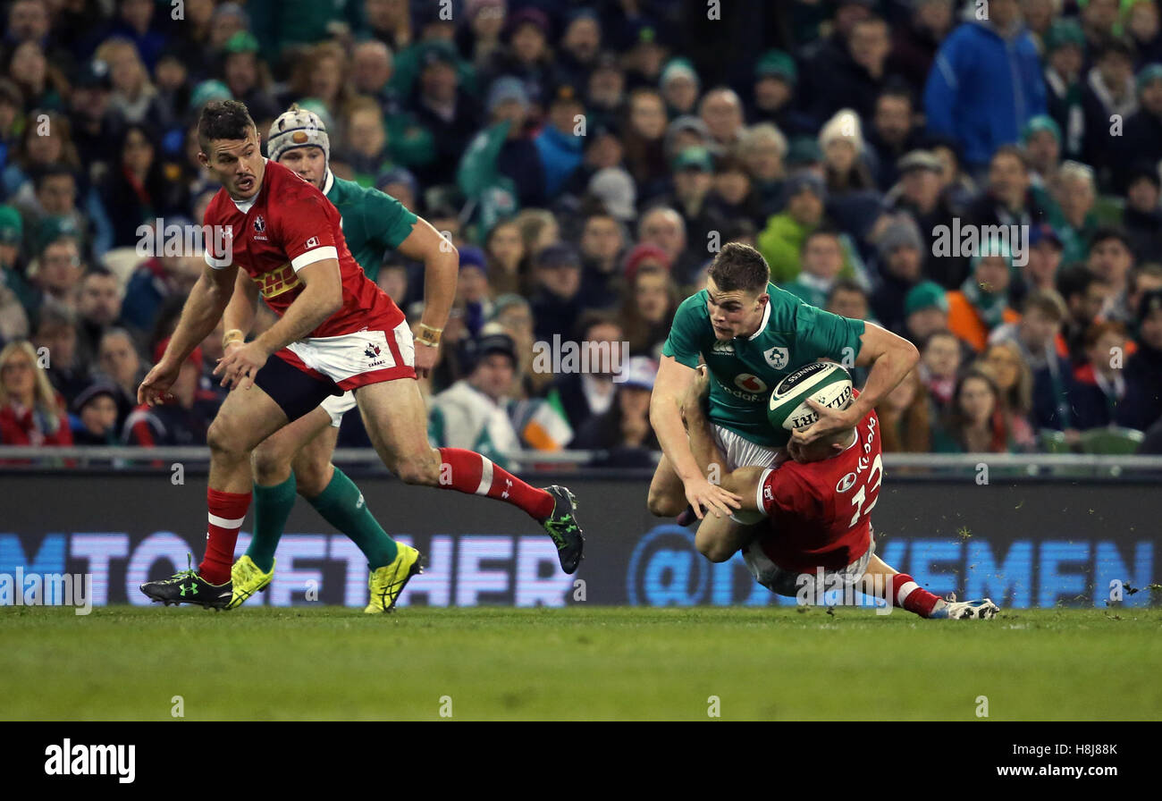Ireland's Garry Ringrose is tackled by Canada's Conor Trainor during ...