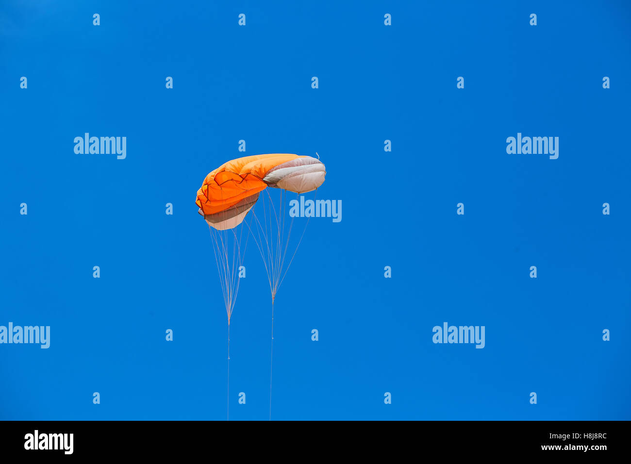 Orange kite in the sky and cloud Stock Photo - Alamy