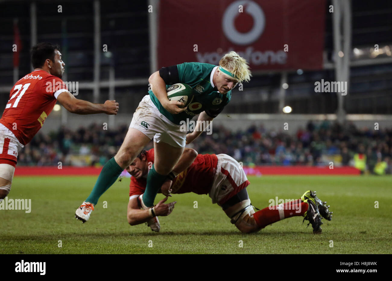 Ireland's James Tracy powers over to score his side's eighth try during ...