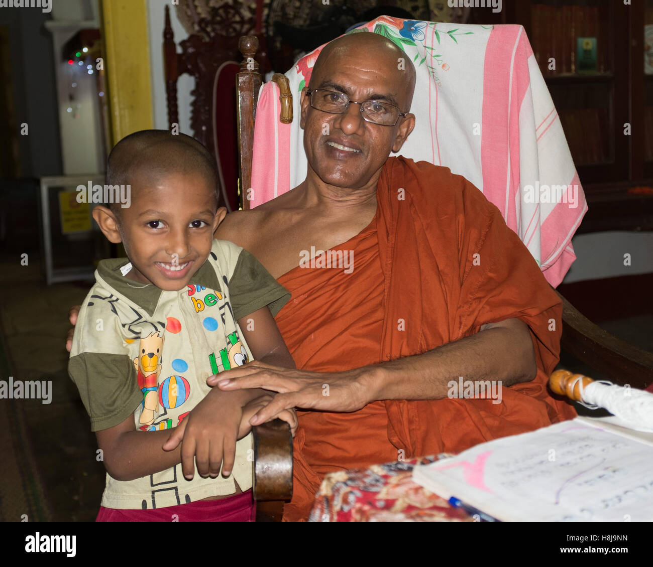 Buddhist monk with a smiling young boy in Sri Lanka © Juergen Hasenkopf ...