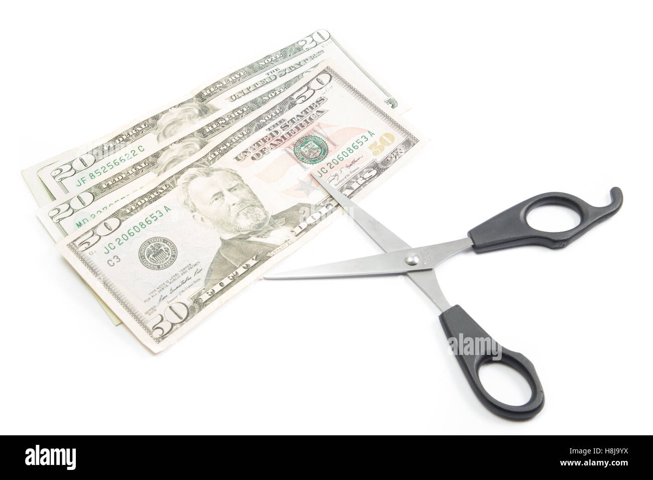 Cutting american dollar, money savings reduction concept Stock Photo ...