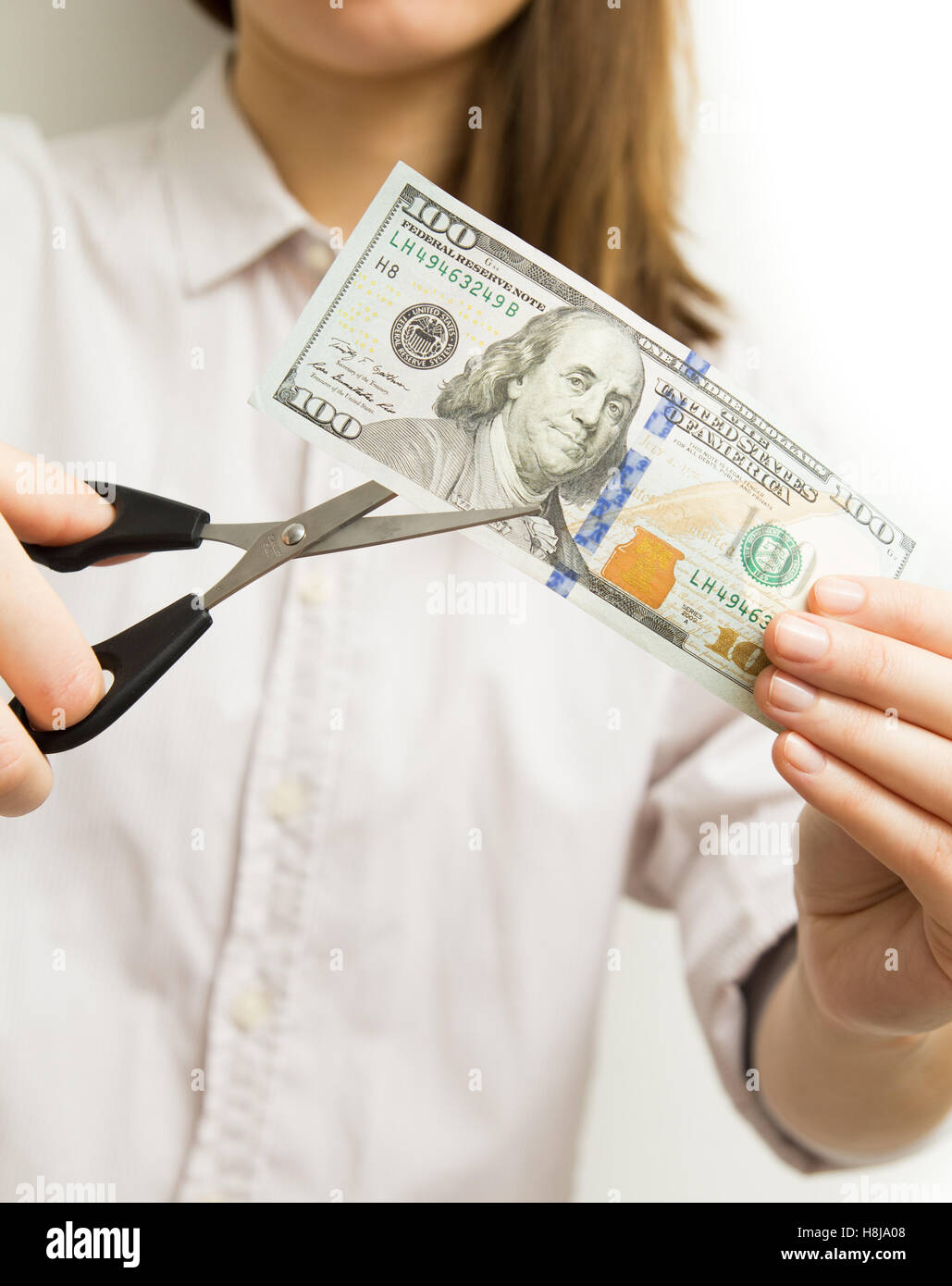Cutting american dollar, money savings reduction concept Stock Photo ...