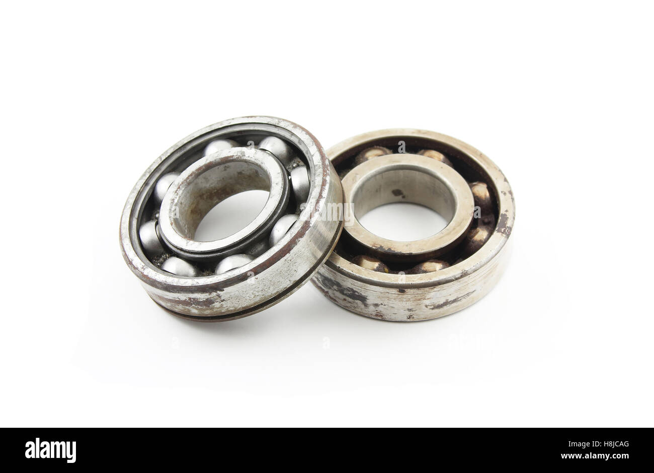 Two old rusty bearing on a white background Stock Photo - Alamy