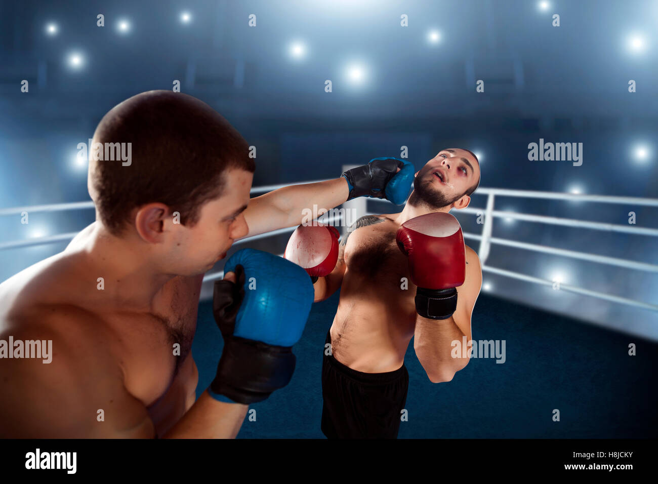 Boxer sents his opponent to the knockout Stock Photo - Alamy