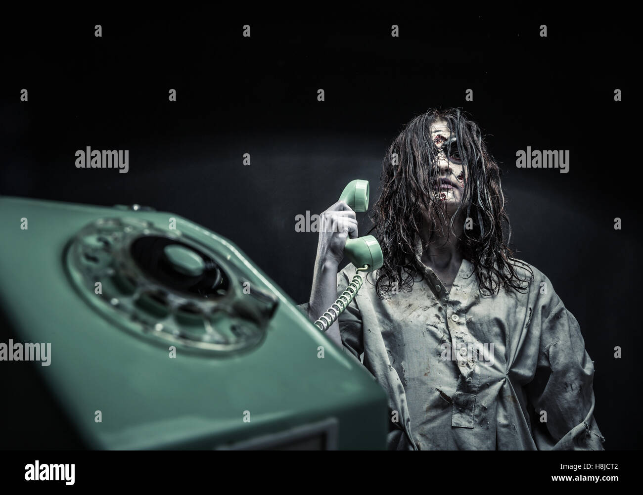 Horror zombie girl calling by phone Stock Photo - Alamy