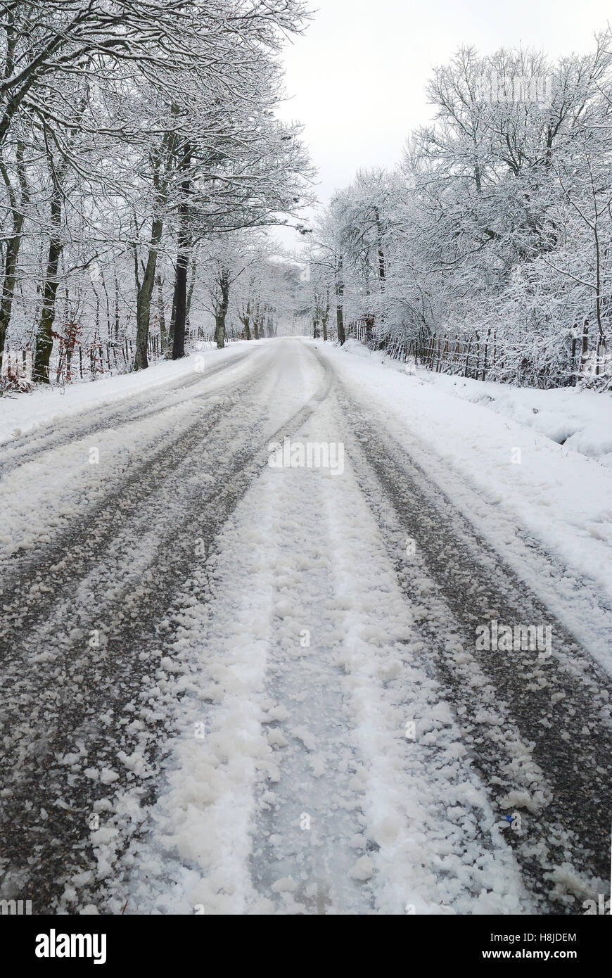 Dangerous street with ice and snow Stock Photo - Alamy