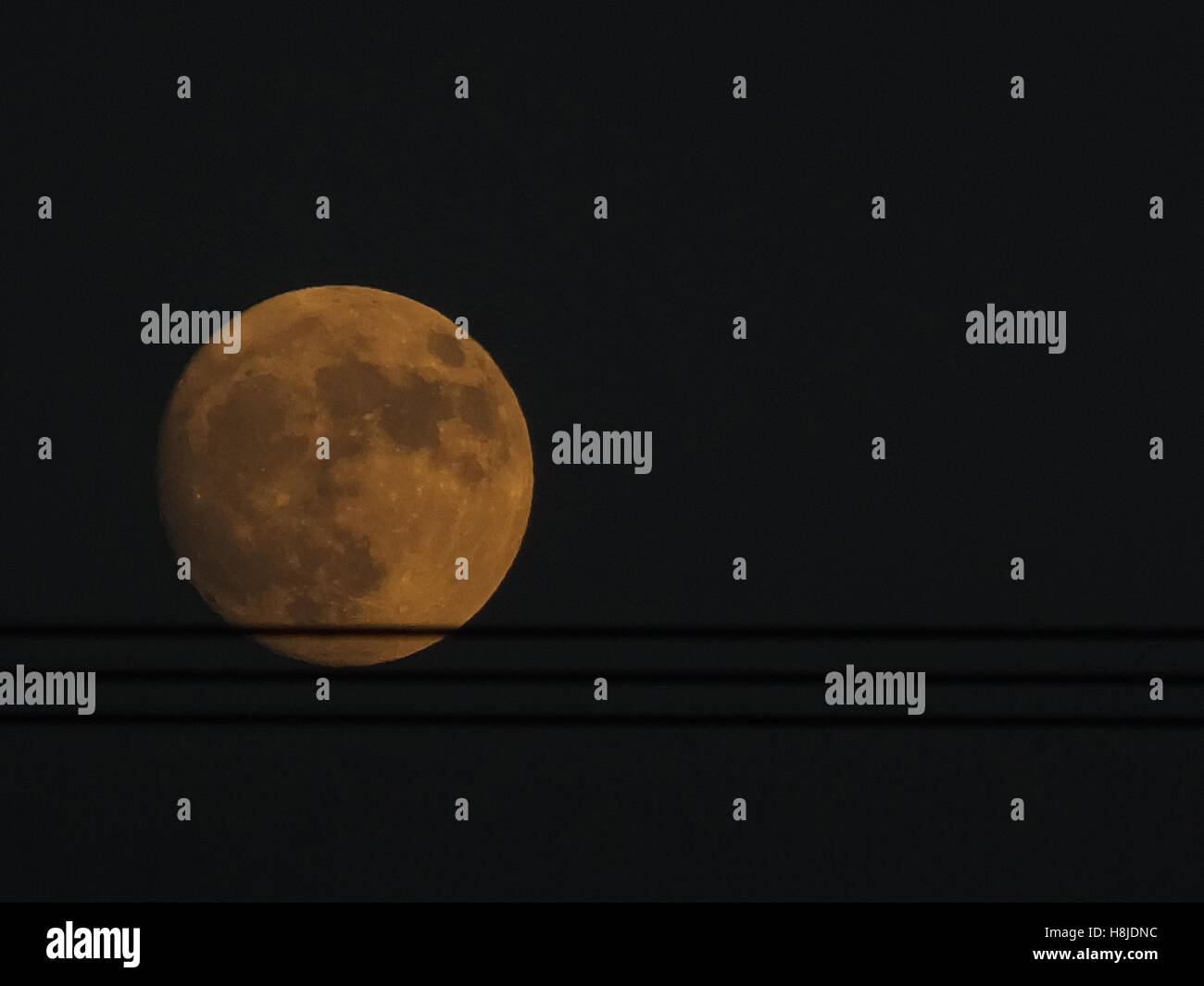 full moon rising background Stock Photo - Alamy