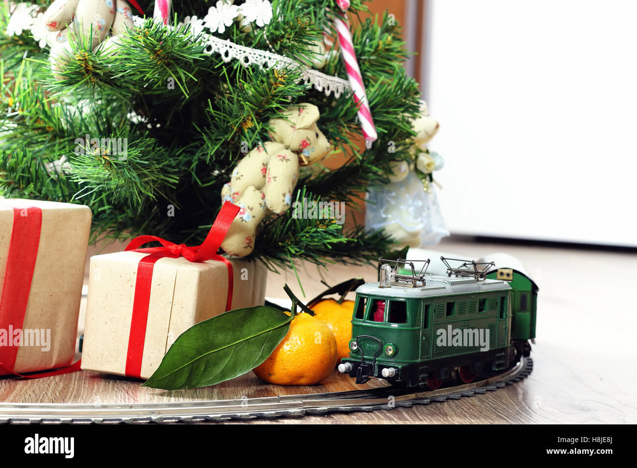 train under tree gift Stock Photo - Alamy