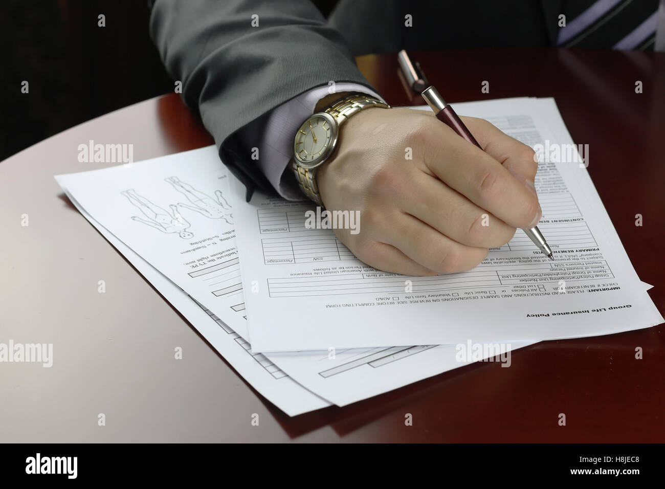hand signed insurance Stock Photo - Alamy