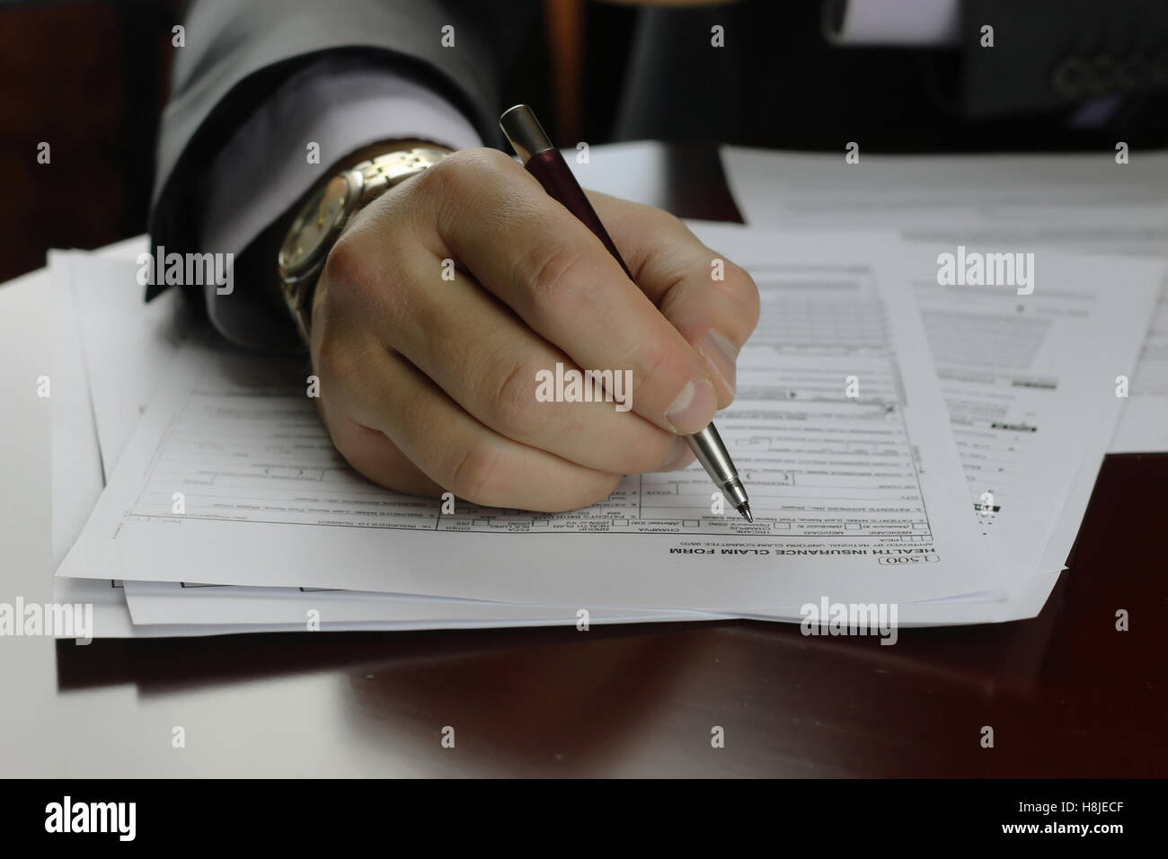 hand signed insurance Stock Photo - Alamy