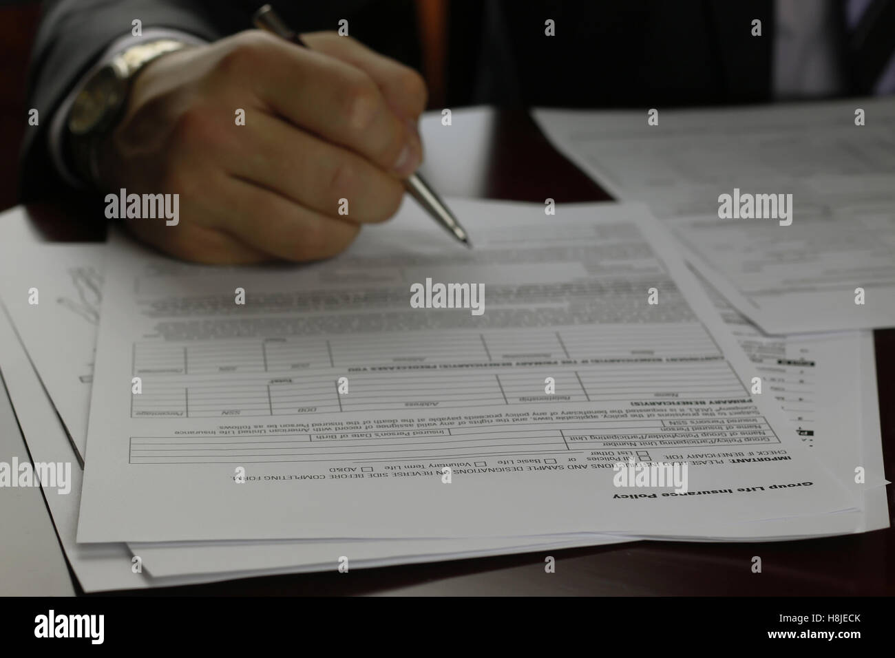 hand signed insurance Stock Photo - Alamy