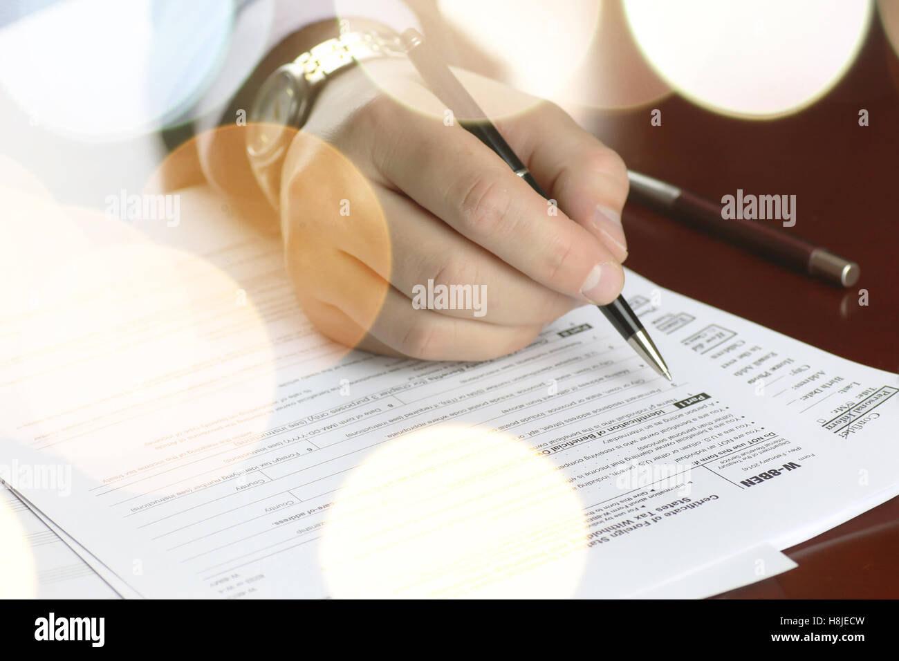 hand signed tax form Stock Photo - Alamy
