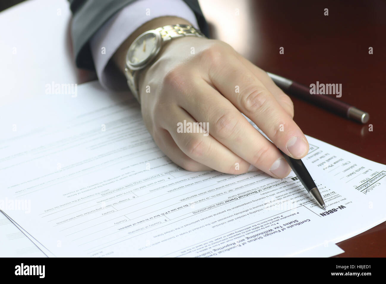 hand signed tax form Stock Photo - Alamy