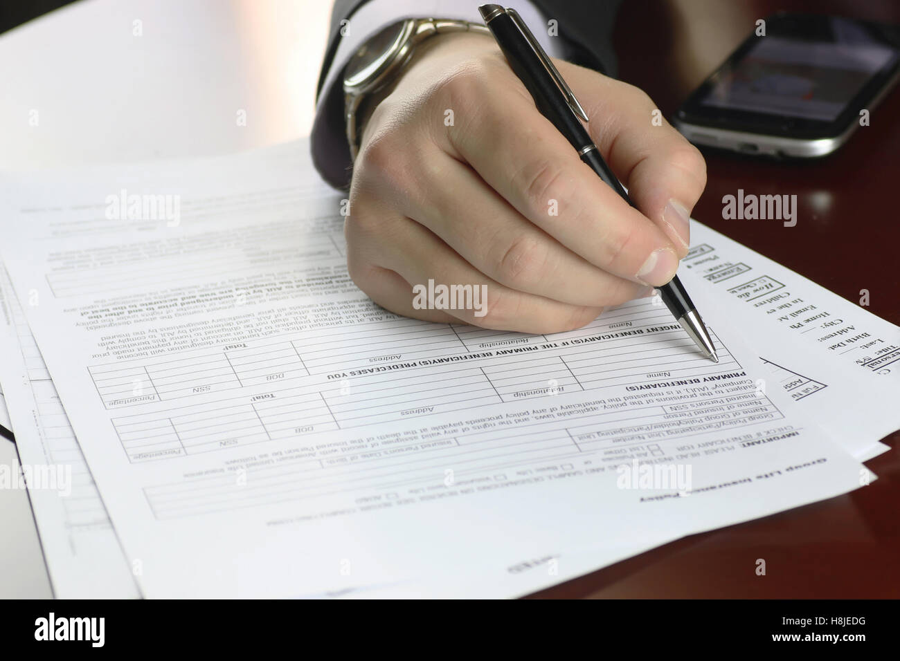 hand signed insurance Stock Photo - Alamy