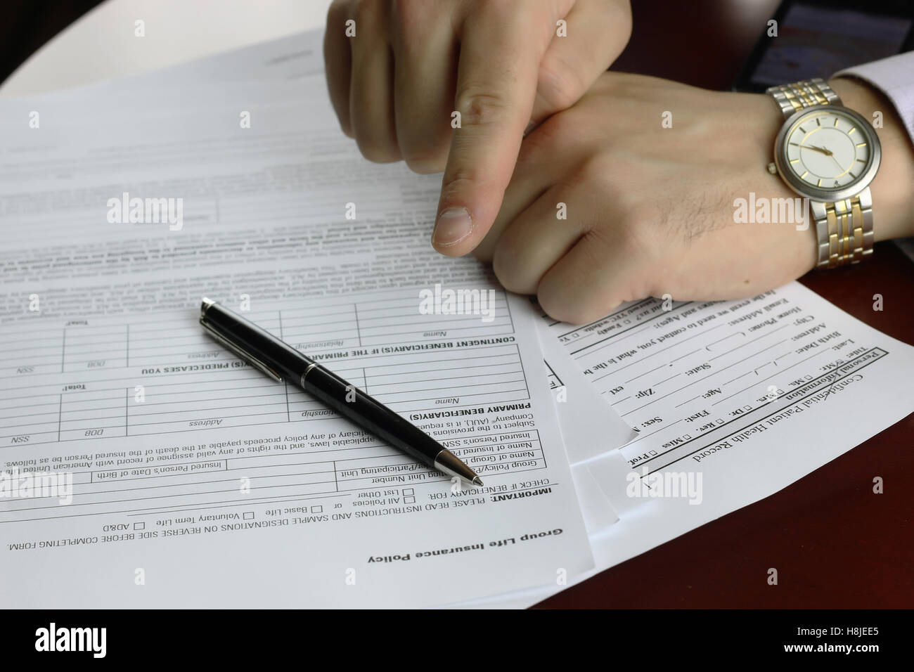 hand signed insurance Stock Photo - Alamy