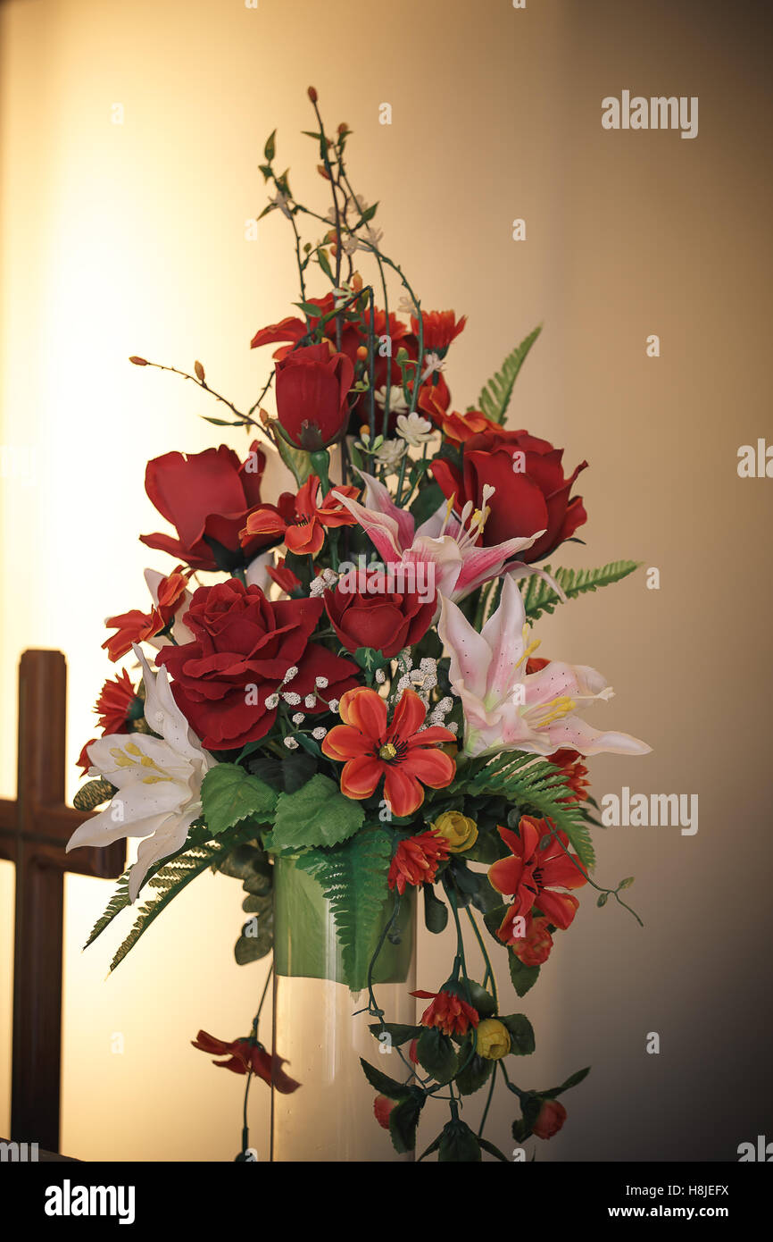 Decorative plastic flowers in the room Stock Photo - Alamy