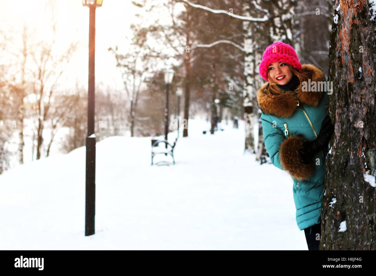 young woman tree winter Stock Photo - Alamy