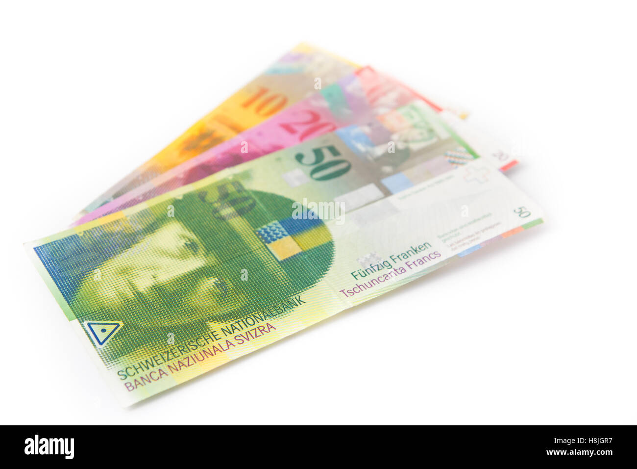 Swiss franc paper money isolated on white background Stock Photo - Alamy