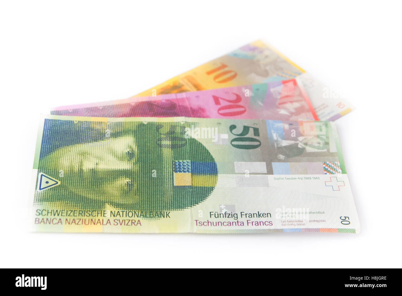 Swiss franc paper money isolated on white background Stock Photo - Alamy