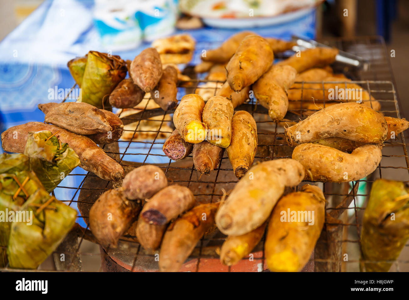 sweet potato burned on old steel stove Stock Photo - Alamy