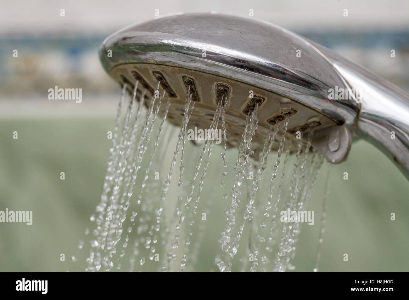 Closeup of shower head with flowing water splashing out, drops Stock ...