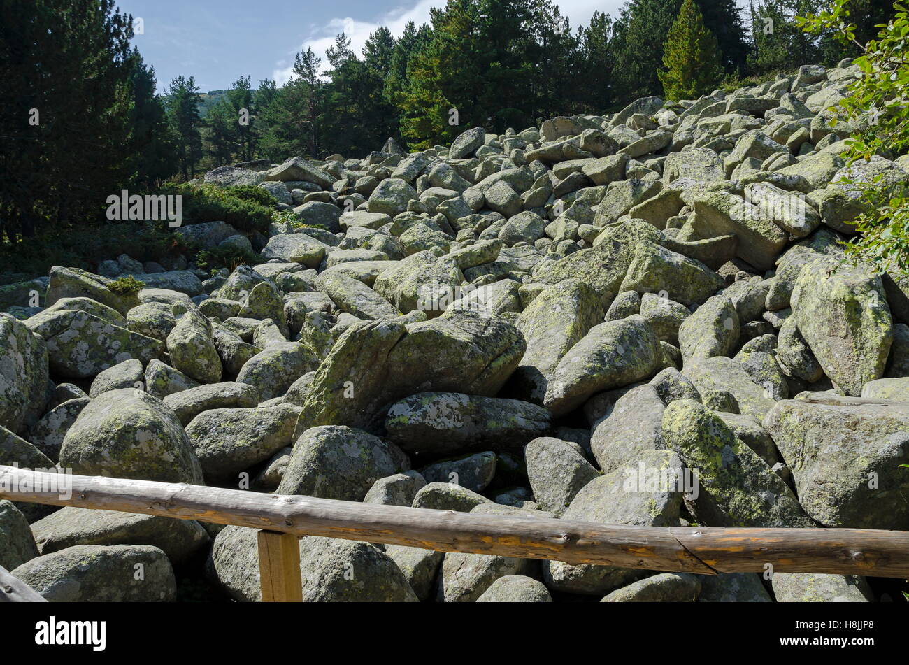 Unique stone river big granite stones on rocky river with wooden bridge ...