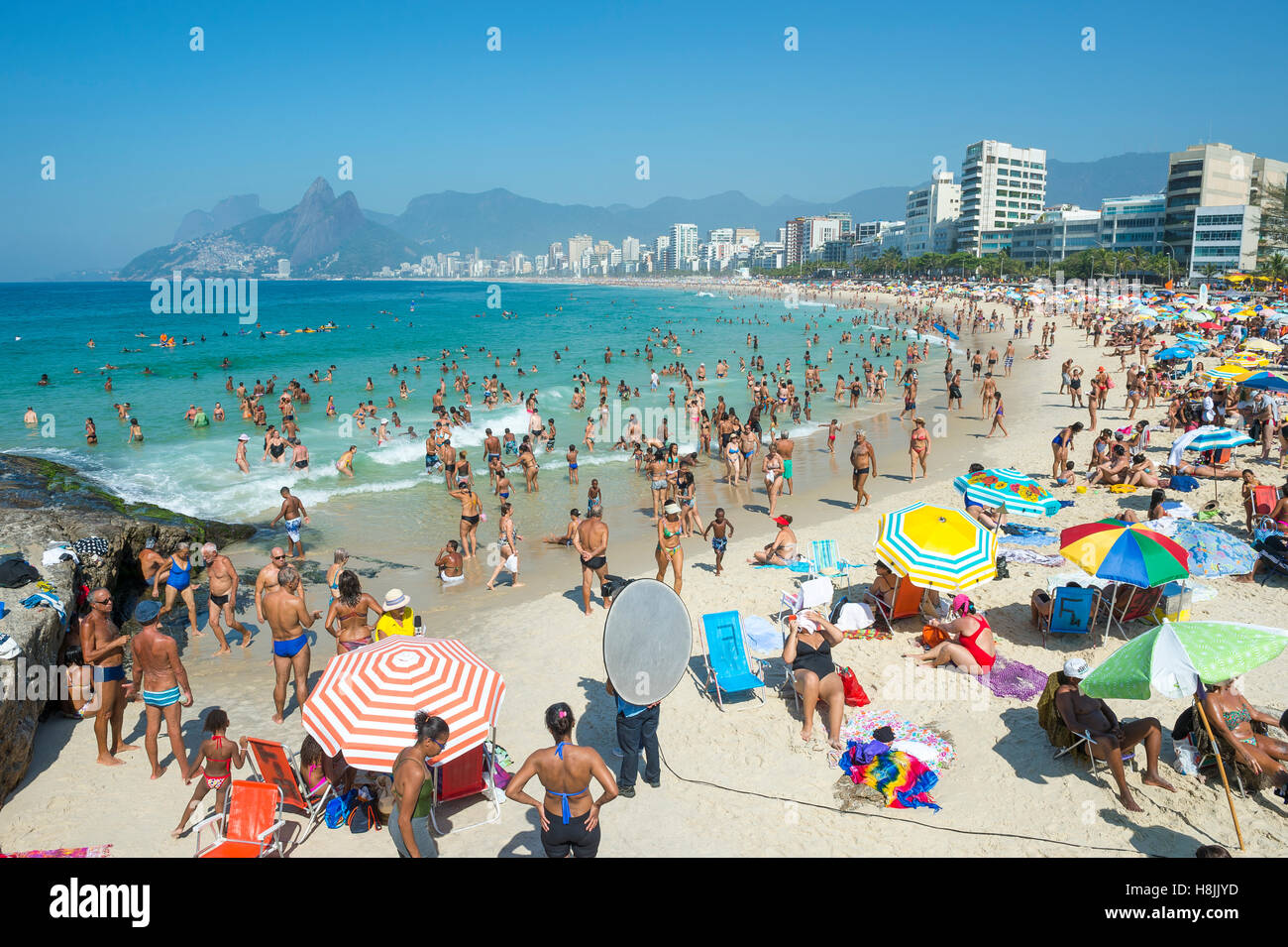 RIO DE JANEIRO - MARCH 01, 2015: Beachgoers relax on the Arpoador end ...