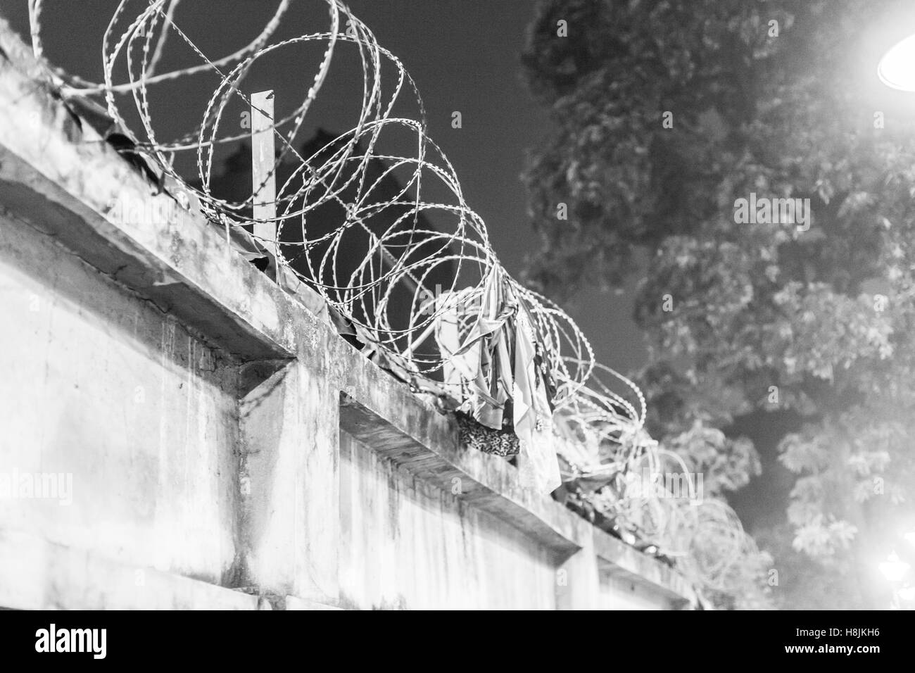 Wall with barbed (razor) wire and caught T-shirt, Kokata (Calcutta ...