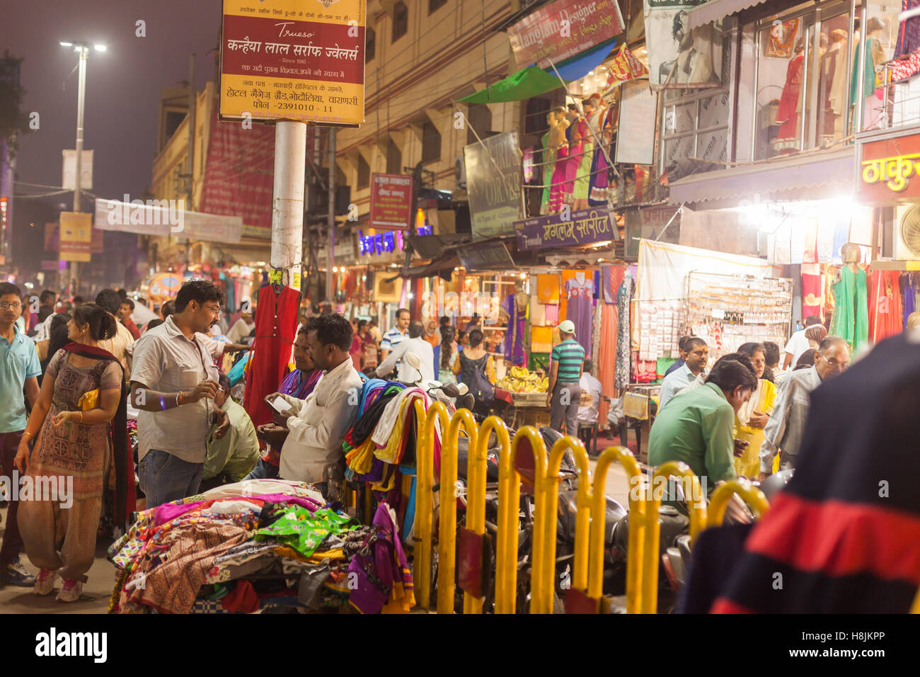 VARANASI, INDIA - 24 Oct 2016: Merchants and customers at the night ...