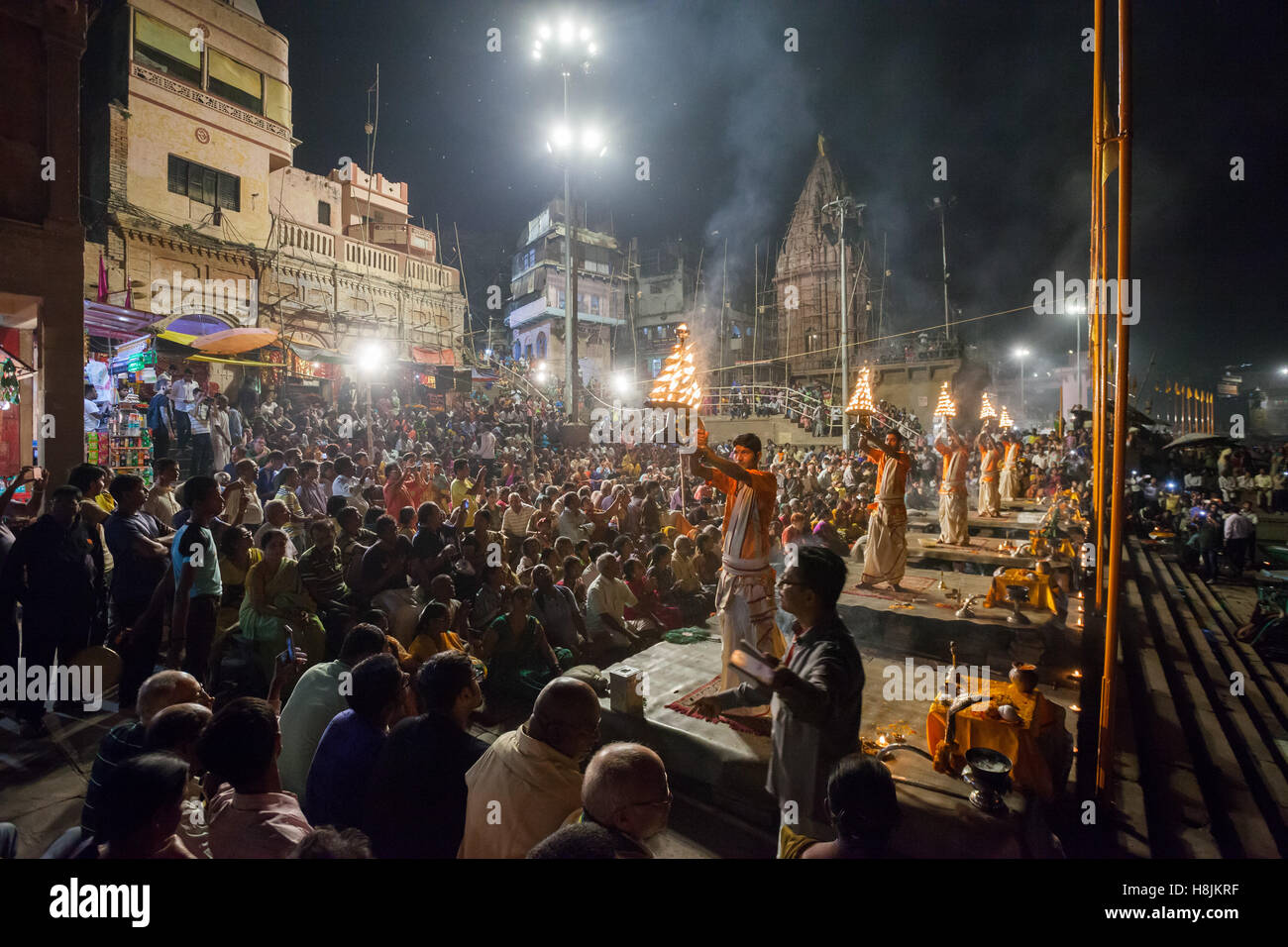 VARANASI, INDIA - 24 Oct 2016: Crowds watch as priests perform the ...