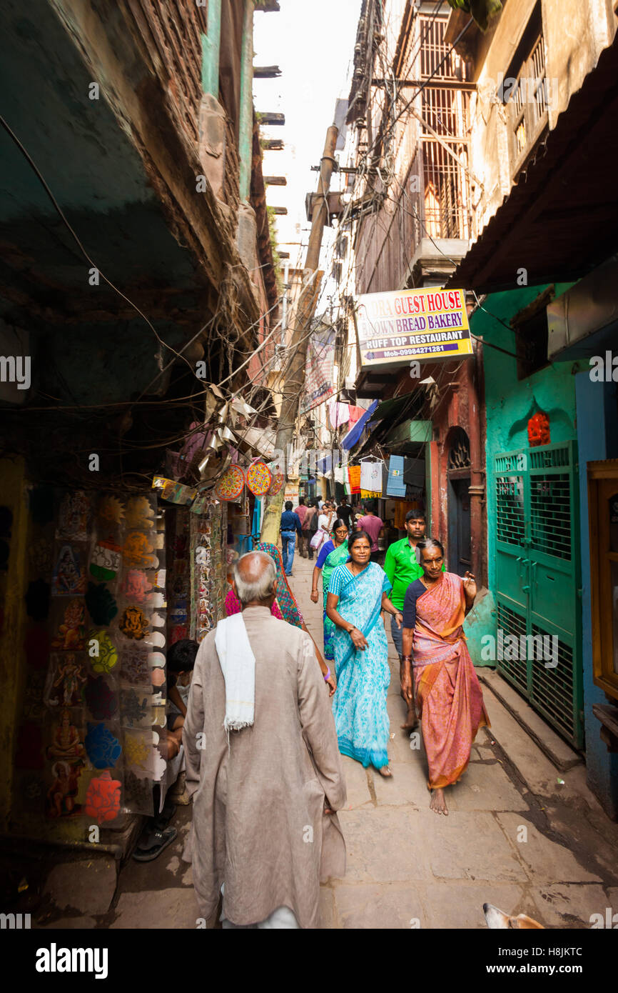 VARANASI, INDIA - 25 Oct 2016: Passerby walk through the alleyways on ...