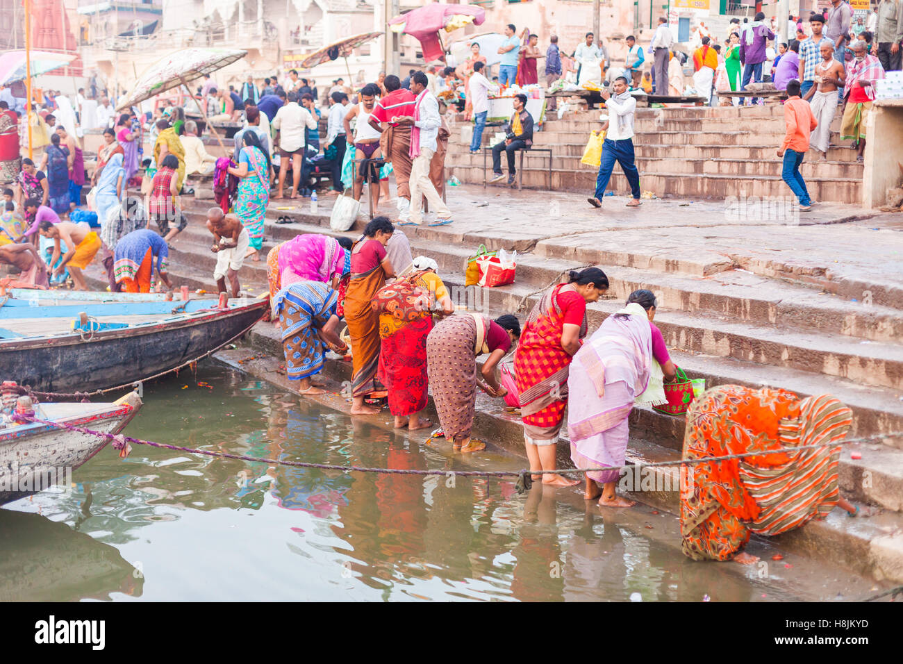 VARANASI, INDIA - 28 Oct 2016: Hindu pilgrims bathe in the River Ganges ...