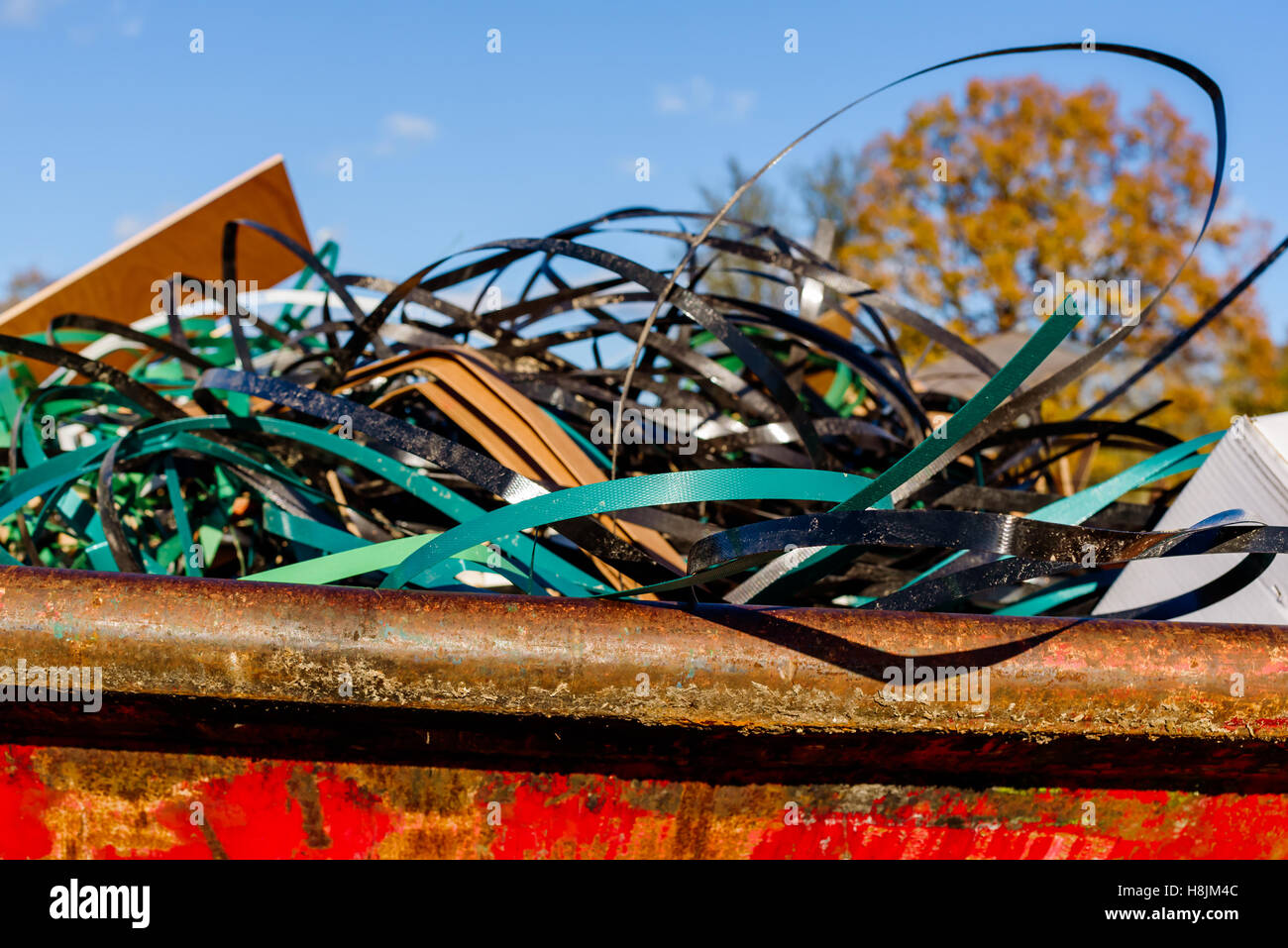 Metal and plastic waste in rusty old container Stock Photo - Alamy
